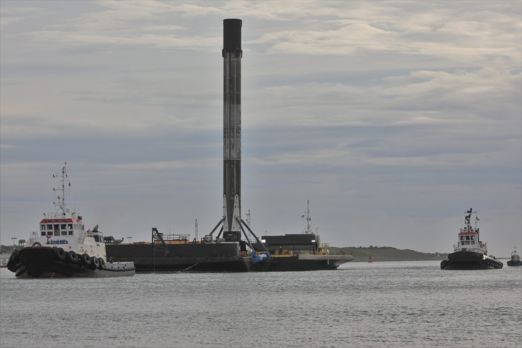 1st Quadruply Launched/Landed SpaceX 1st Stage Booster Sails into Port ...
